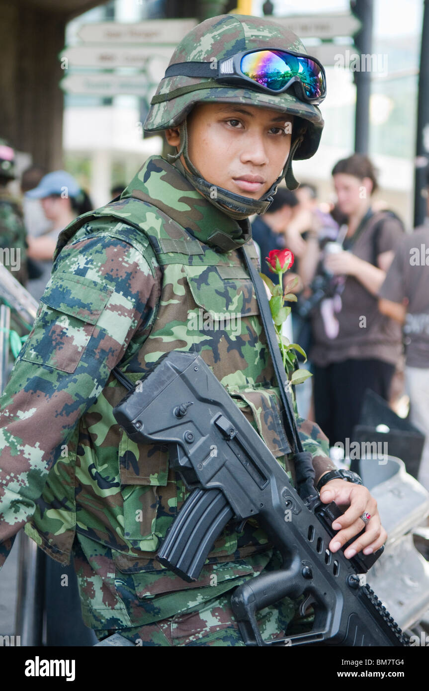 soldier with flower in the aftermath of the battle with the Red Shirts ...