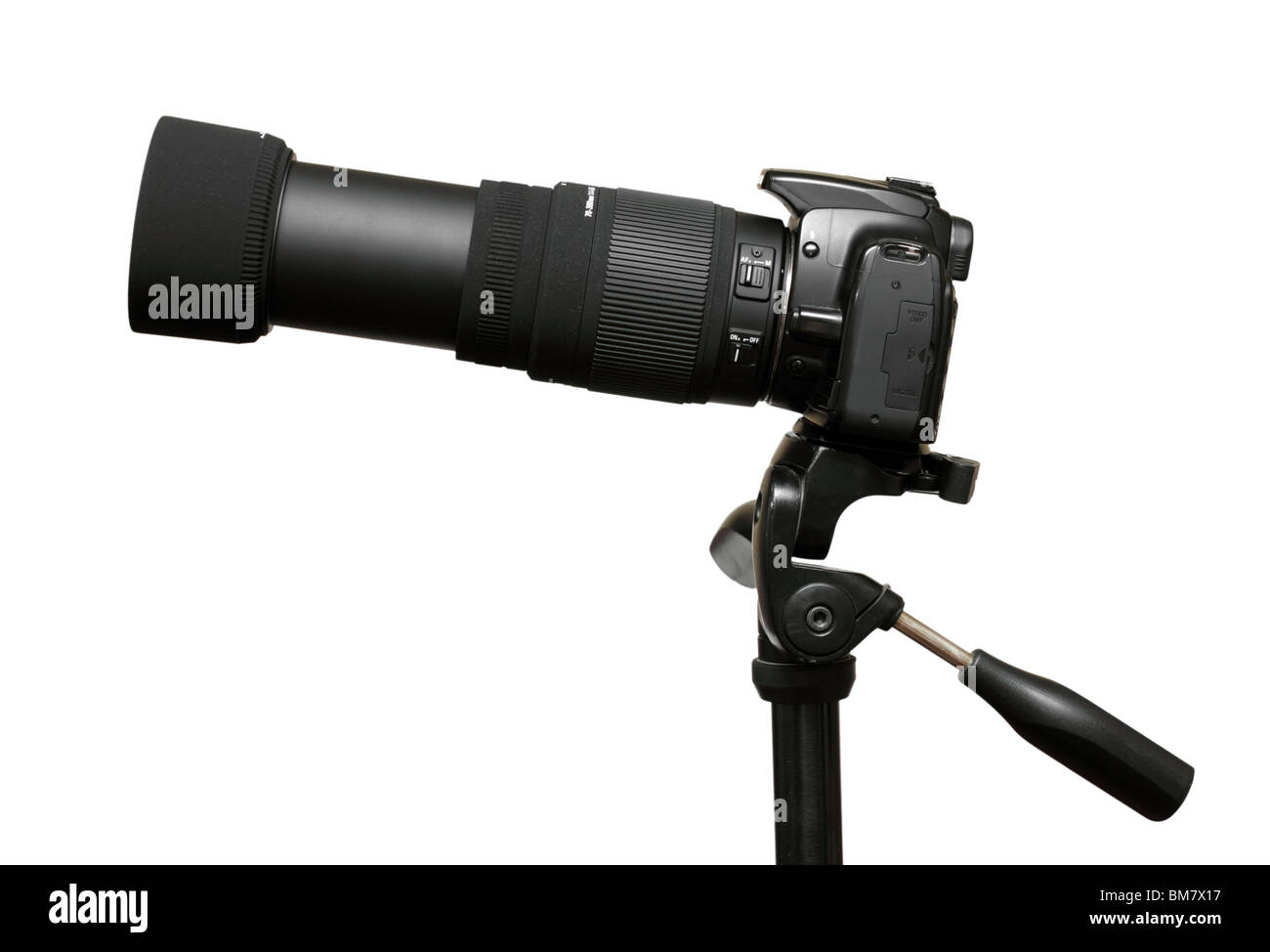 DSLR camera with telephoto zoom lens on tripod isolated on white Stock ...