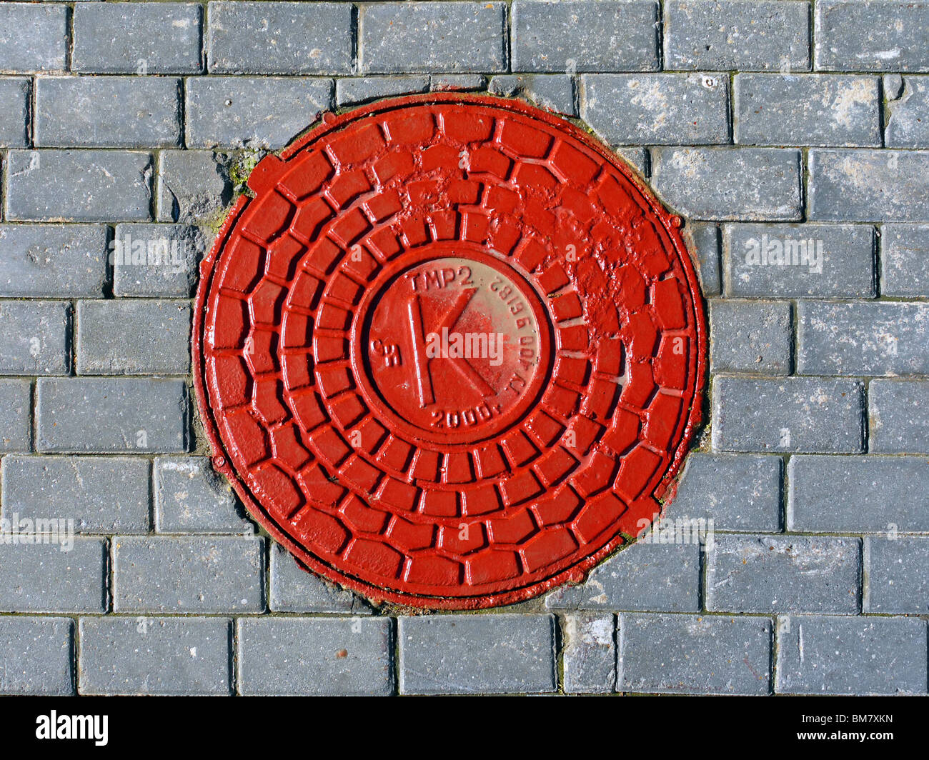 Bright red sewer manhole in Moscow, Russia Stock Photo - Alamy