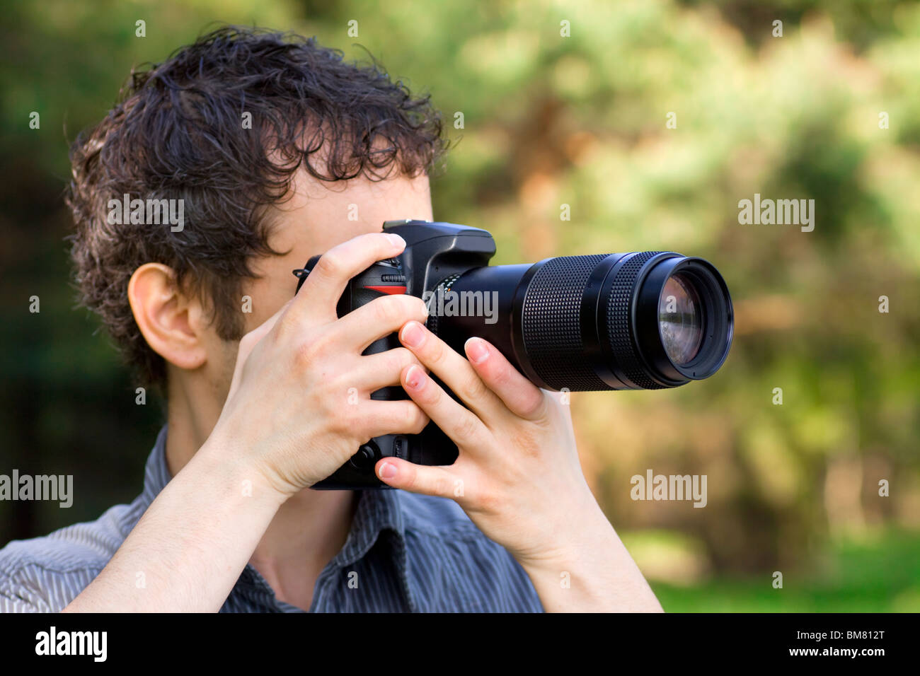 Sneaky photographer getting his shot of nature Stock Photo - Alamy