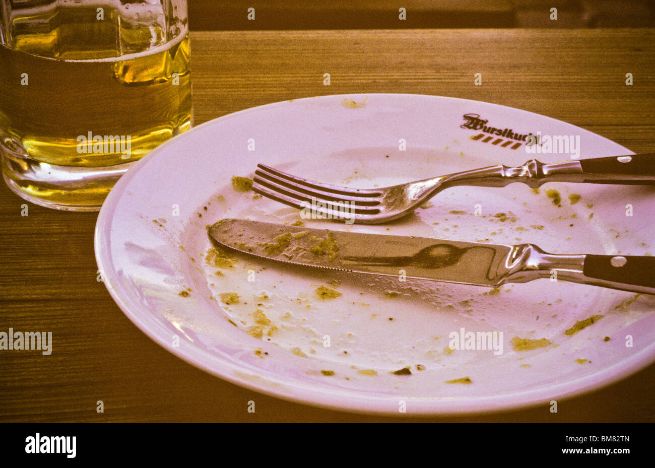 Empty food plate, table. Crumbs, stains Stock Photo - Alamy