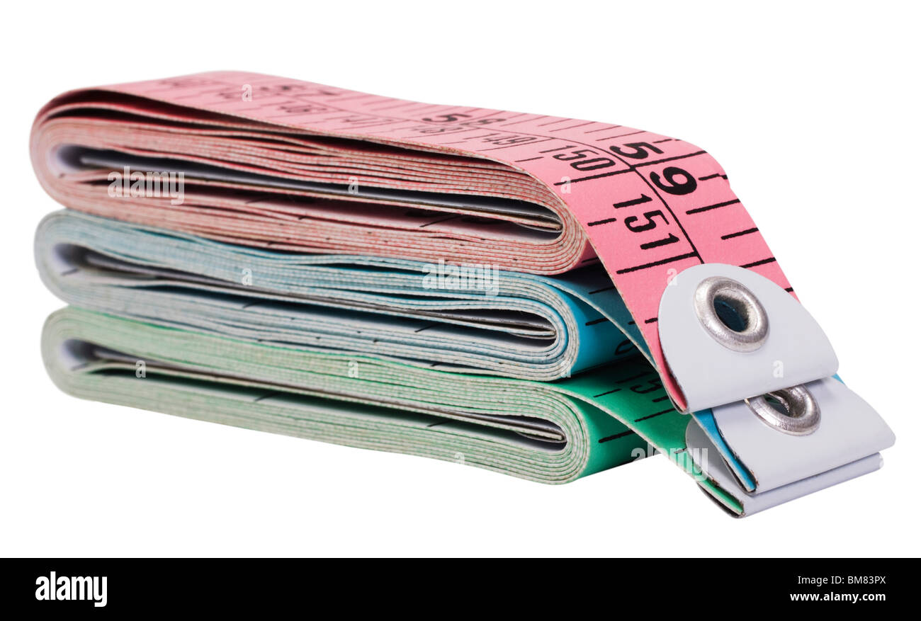 Close-up of a stack of tape measures Stock Photo - Alamy