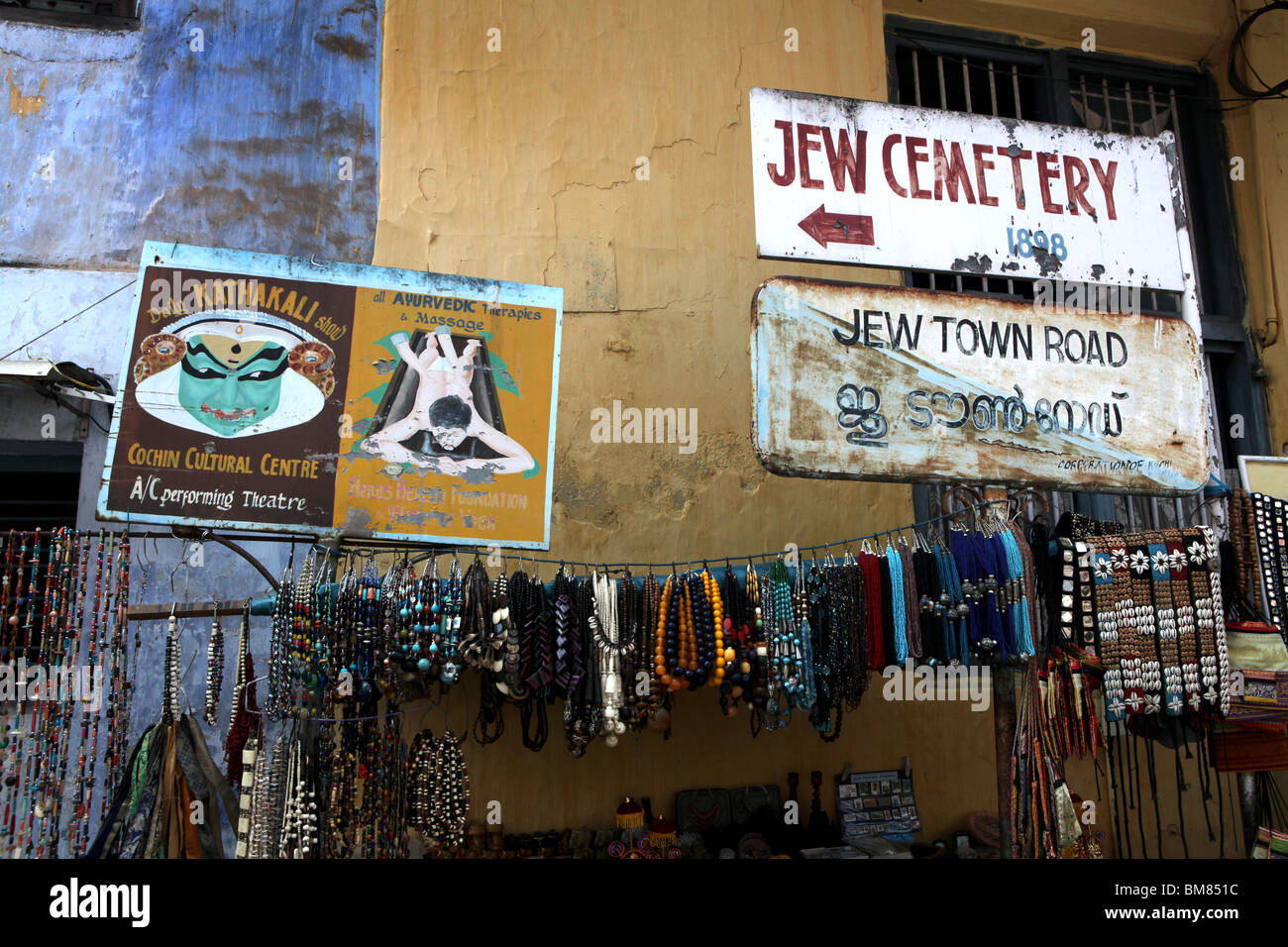 A view of the streets of Jew Town, showing religious beads on display ...