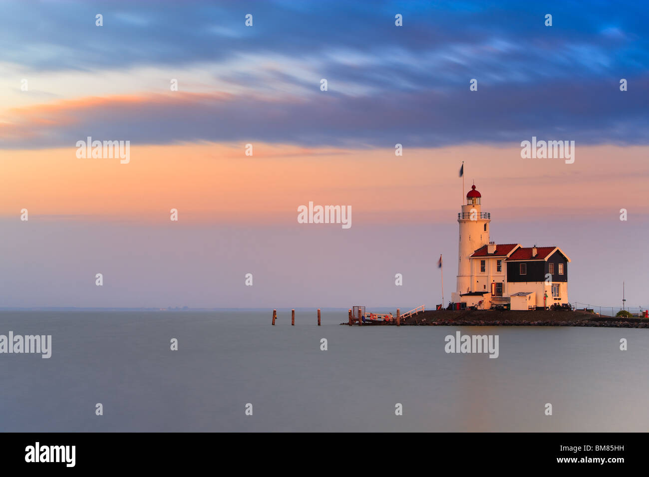 Lighthouse Paard van Marken at sunset Stock Photo - Alamy