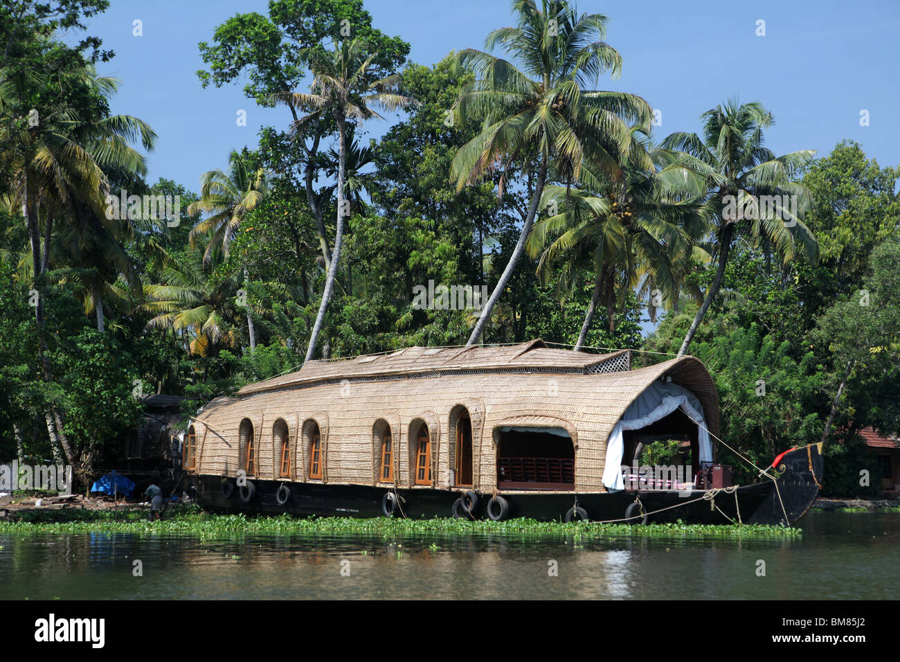 A traditional houseboat on the backwaters of Kerala in India Stock ...