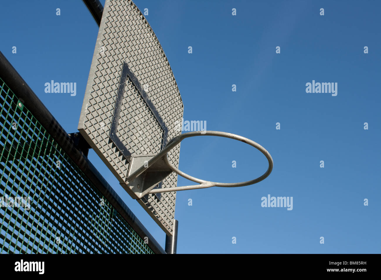 Landscape photo of an urban basketball court on a hot summers day ...