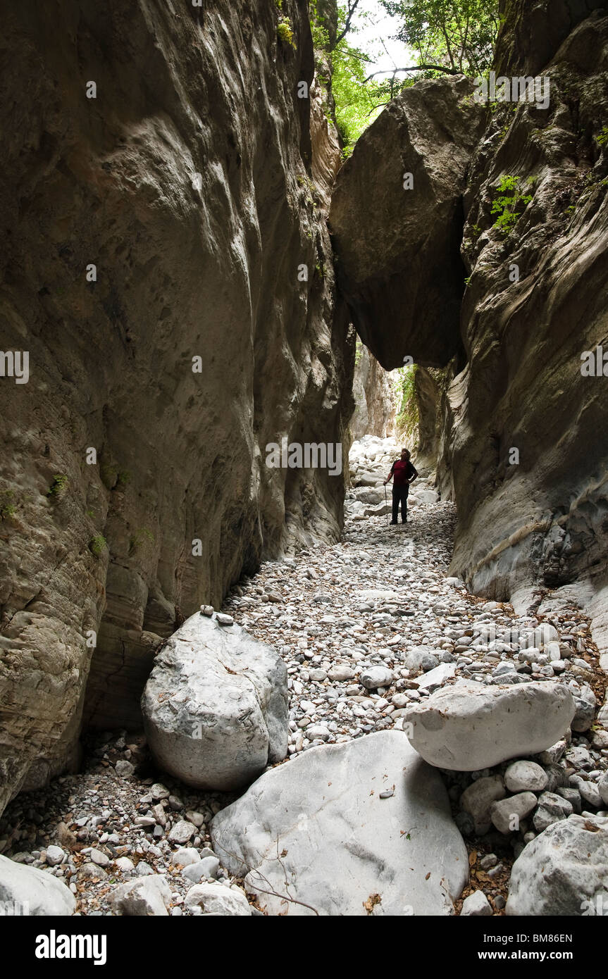 A walker at the narrowest point of the Ridomo Gorge. In the Taygetos ...