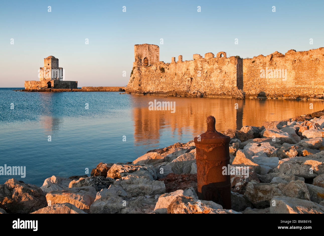 Sunrise on the Venetian walls of Methoni fortress and the Bourtzi tower ...