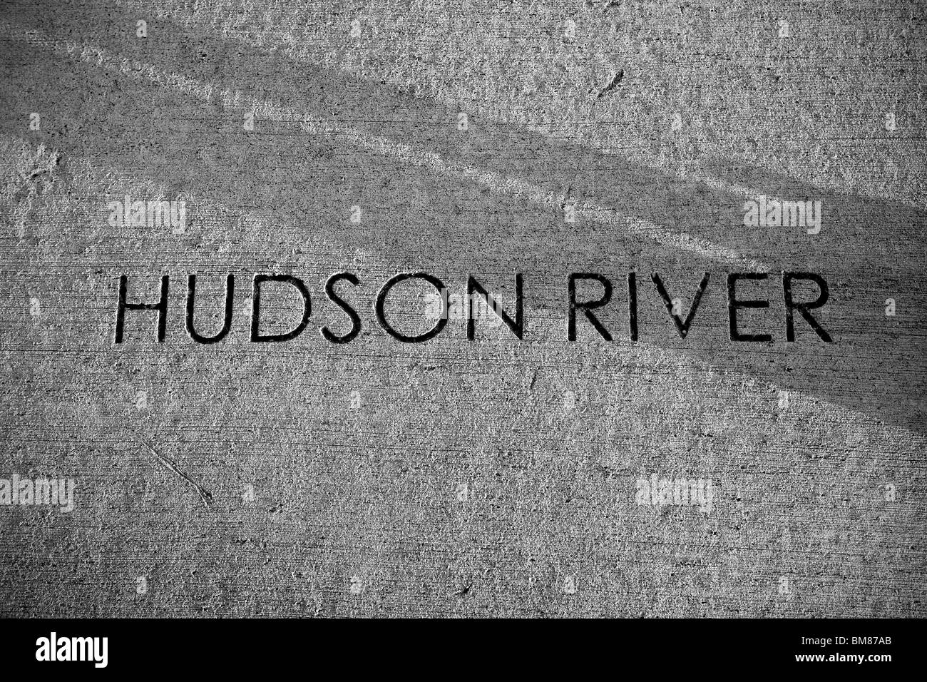 'Hudson River' is etched into the concrete on a path along the Hudson ...