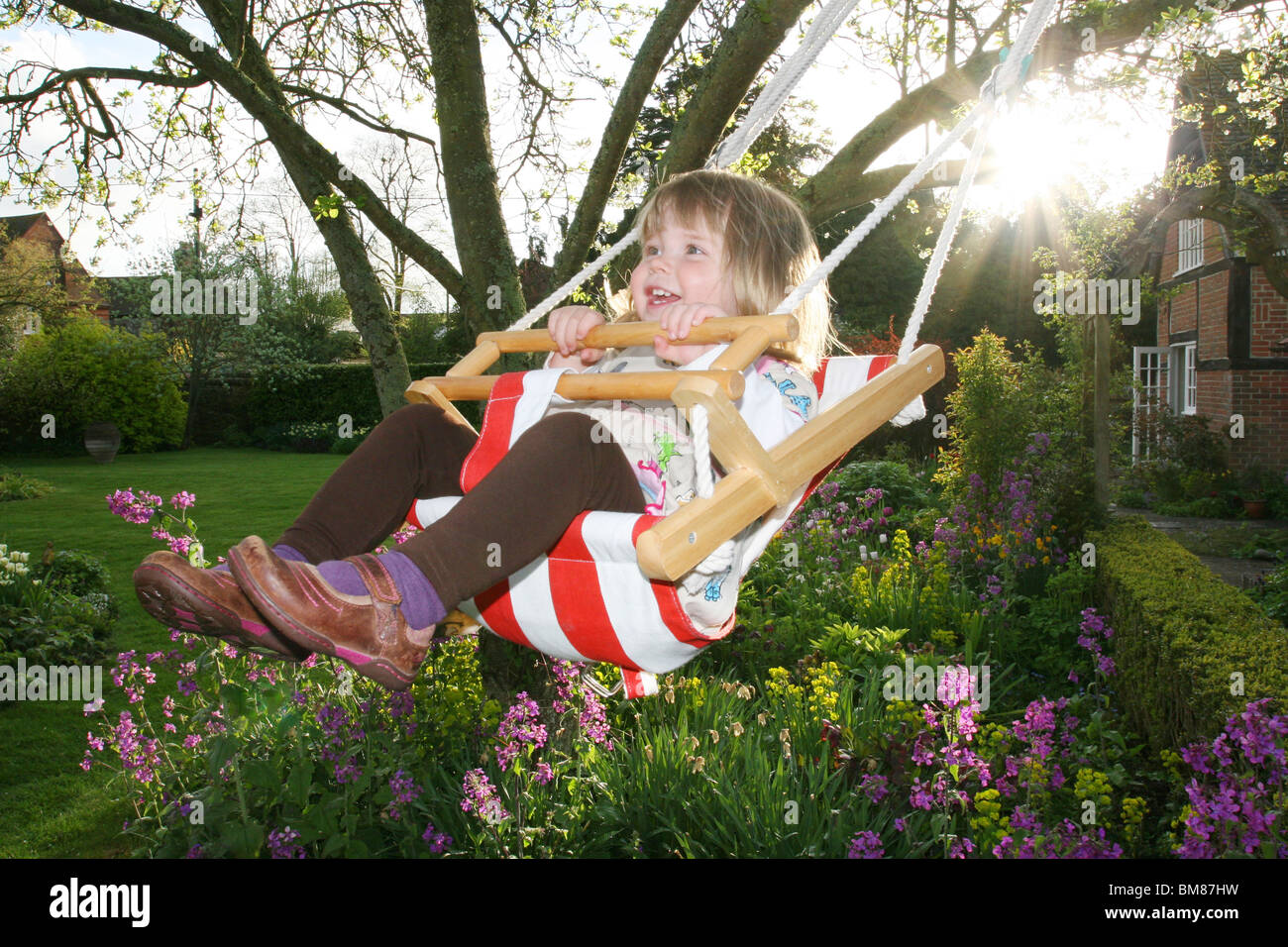 Child swing push hi-res stock photography and images - Alamy