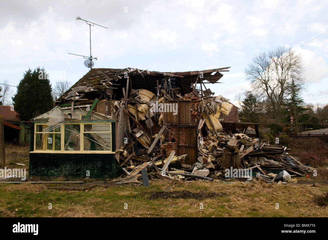 Derelict house being pulled down Stock Photo - Alamy