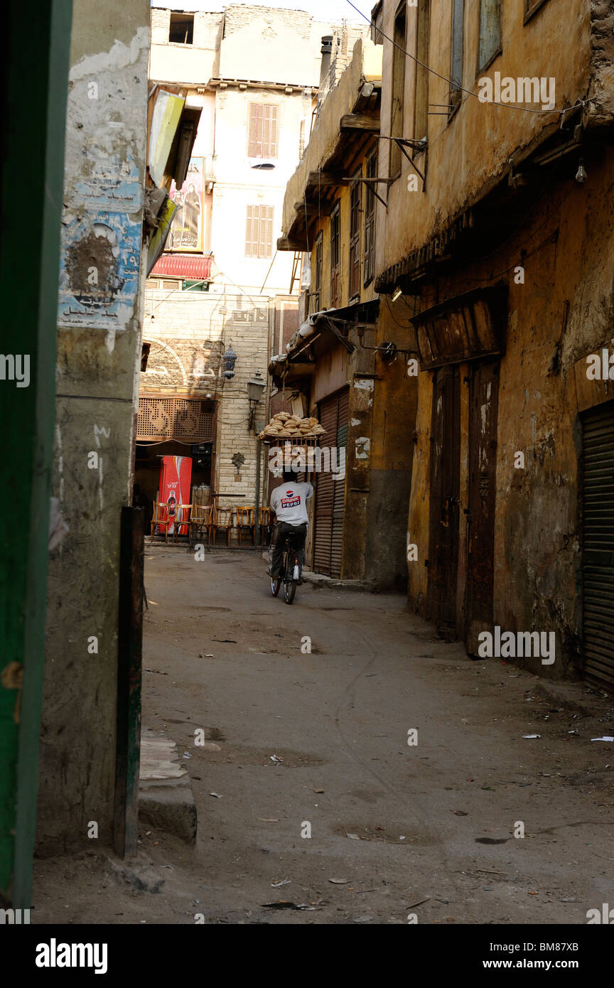 bike rider delivering bread in islamic cairo the traditional egyptian ...