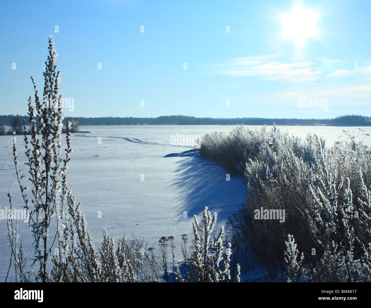 winter landscape with blue sky and sun Stock Photo - Alamy