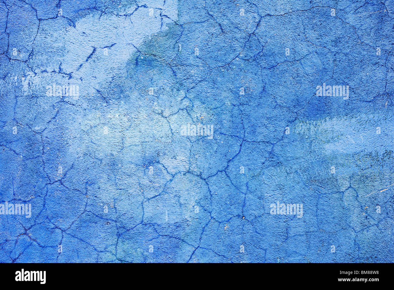 The blue wall are covered with cracked plaster Stock Photo - Alamy