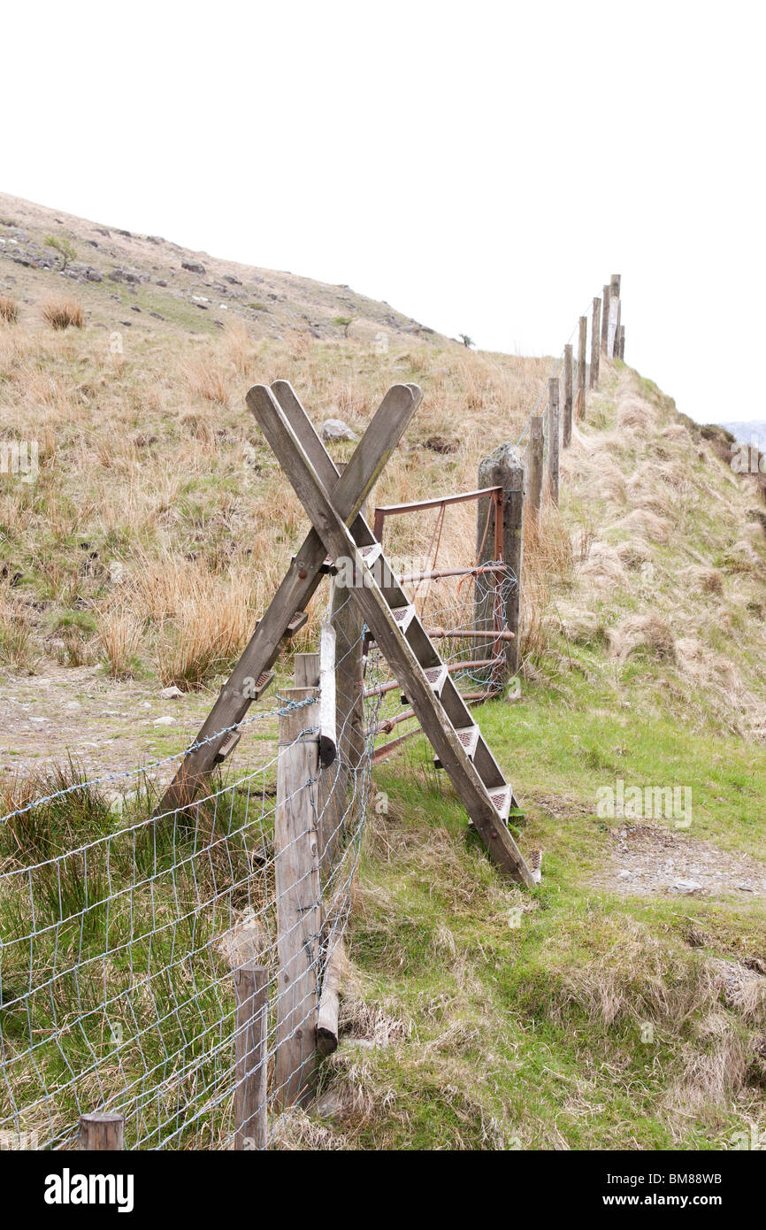 steps over a fence on a mountain footpath Stock Photo - Alamy