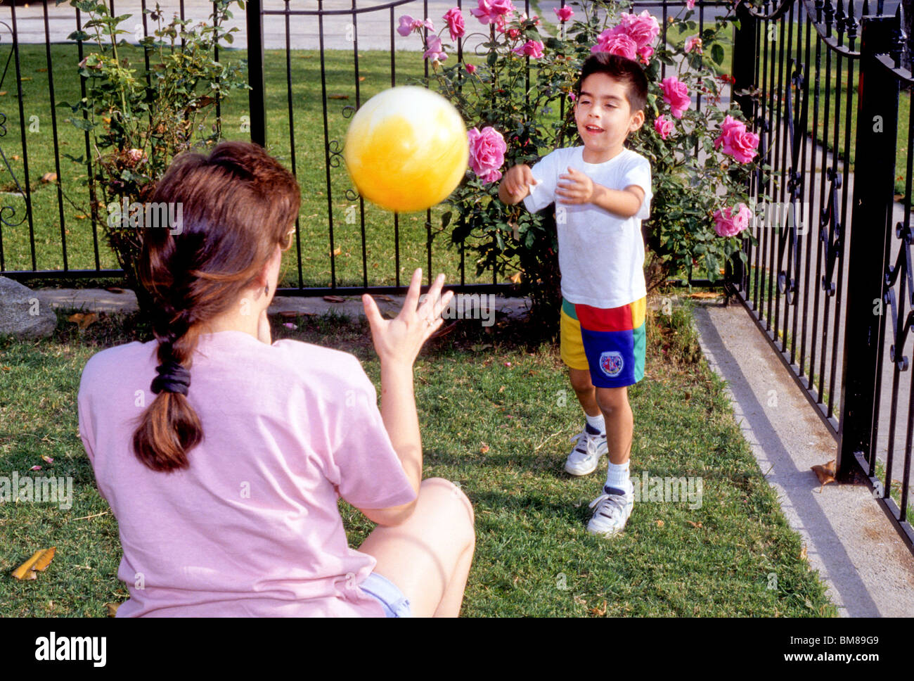 Young hispanic boy play catch hi-res stock photography and images - Alamy