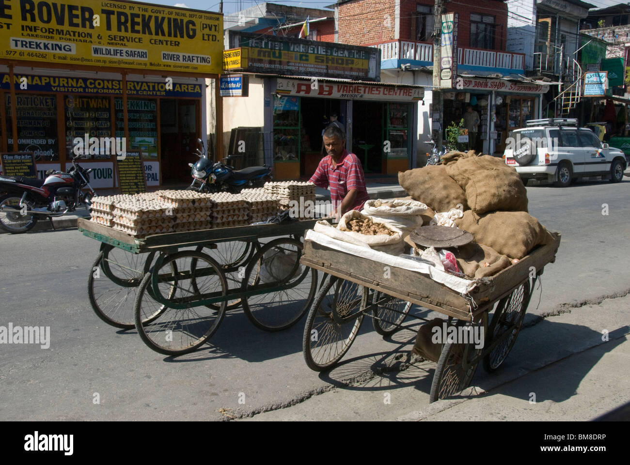 Street scene, street vendors selling potatoes, root crops and eggs ...