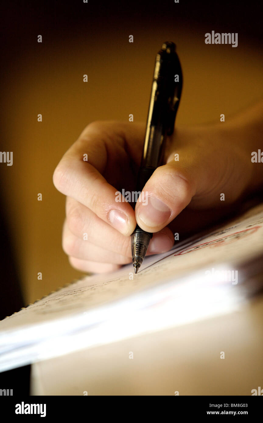 Hand and Pen Stock Photo - Alamy