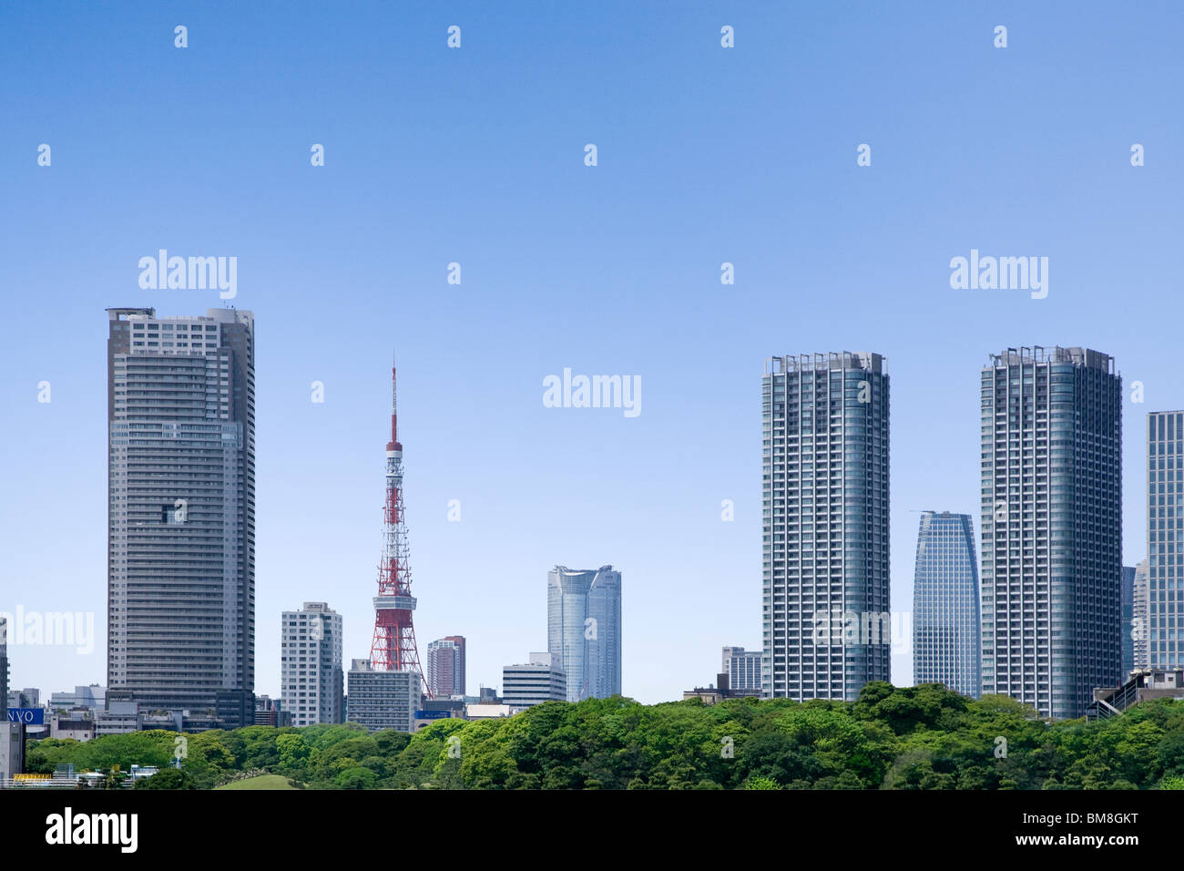 Tokyo Tower and high rise buildings under sky, copy space, Tokyo ...