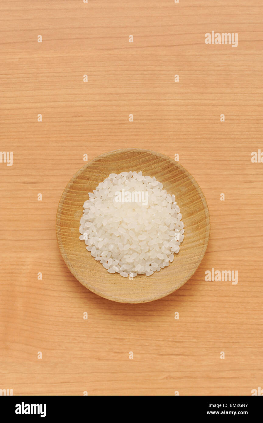 Bowl of raw rice Stock Photo - Alamy
