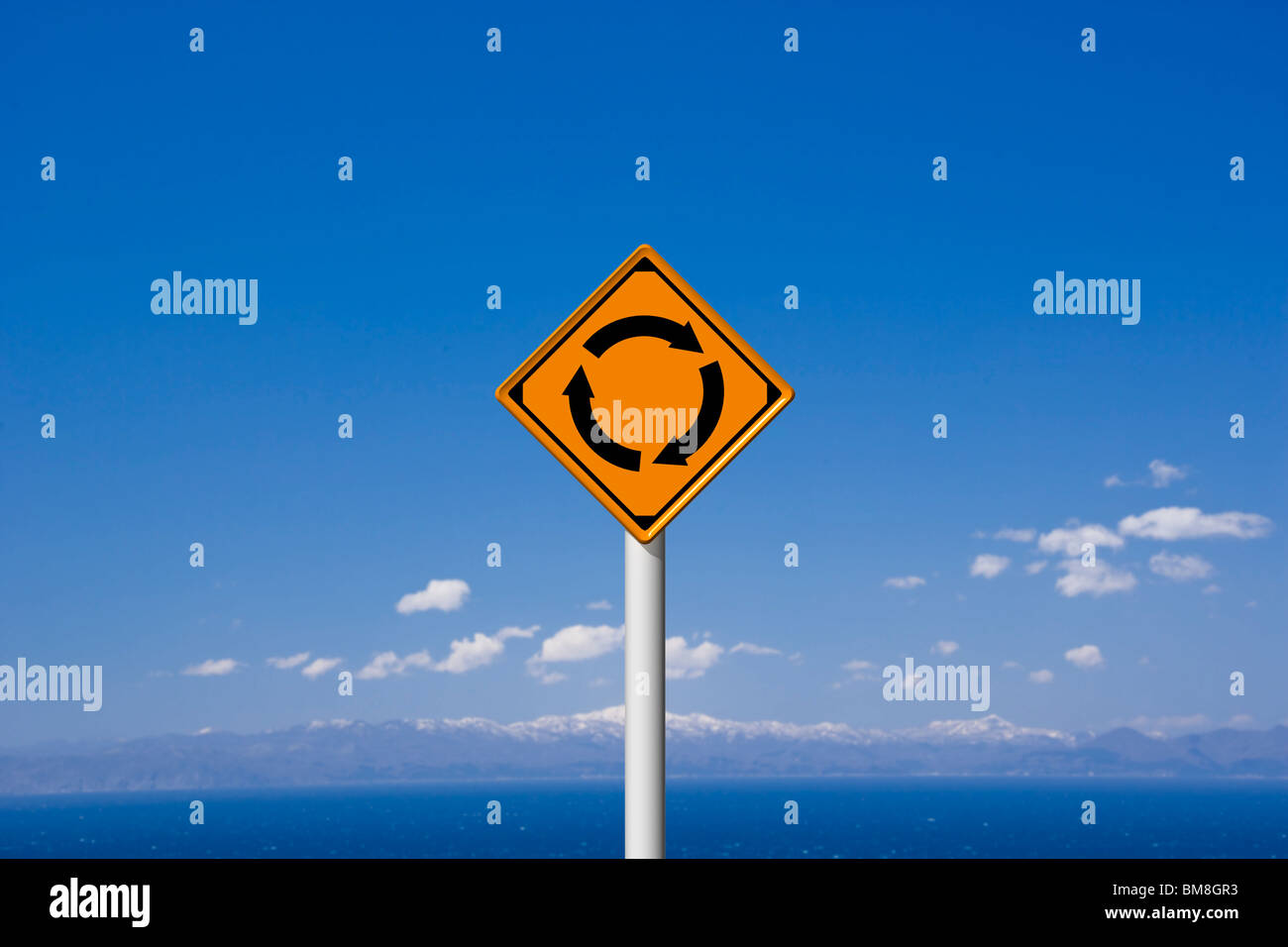 Roundabout sign against sky, computer graphic, copy space Stock Photo ...