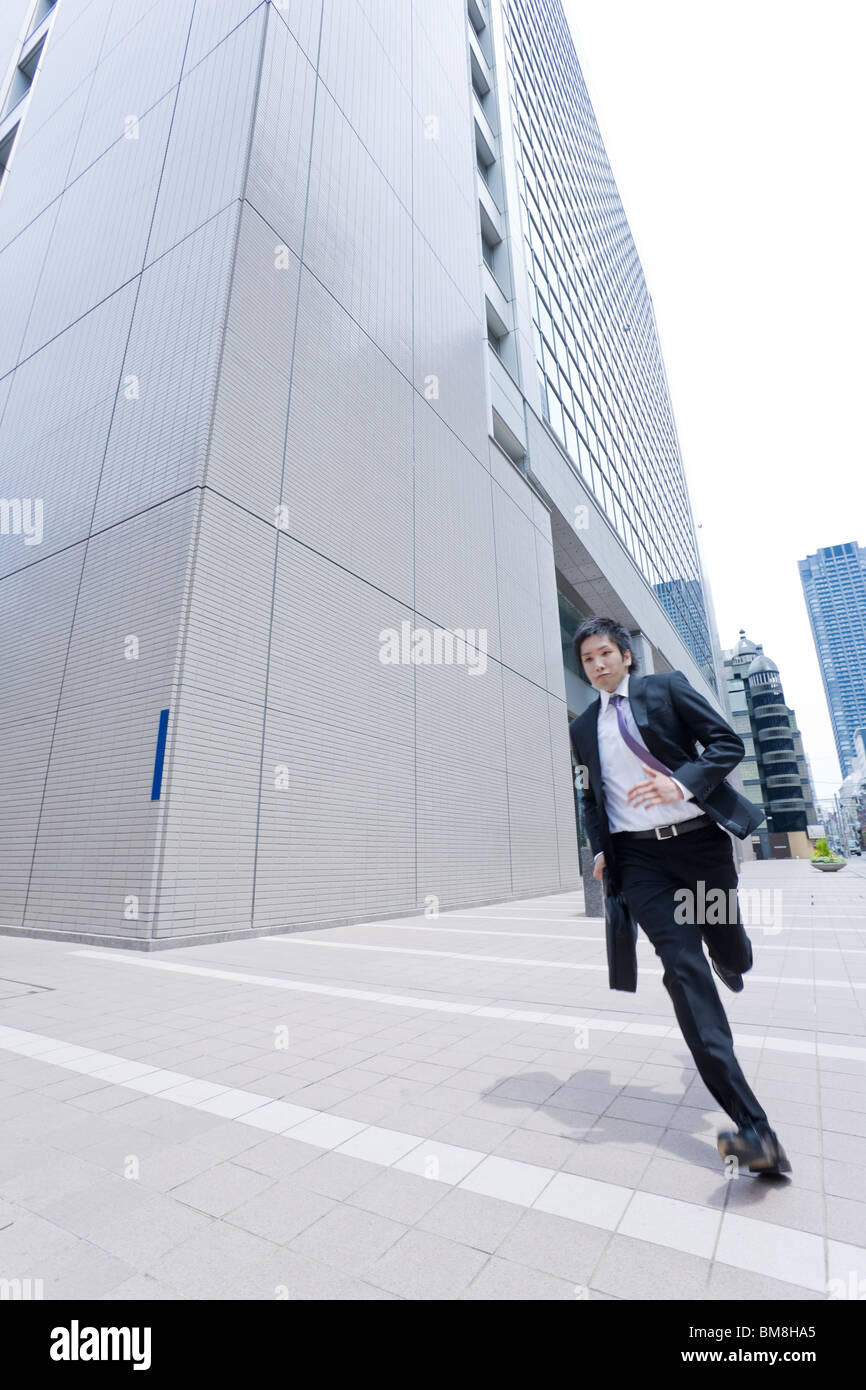 A running businessman Stock Photo - Alamy