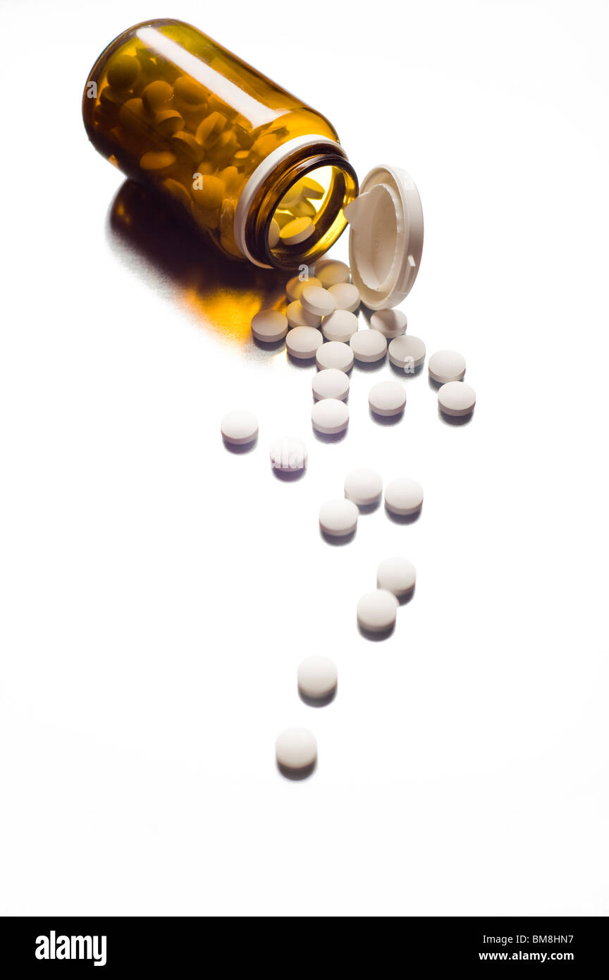 pills spilled from a bottle Stock Photo - Alamy