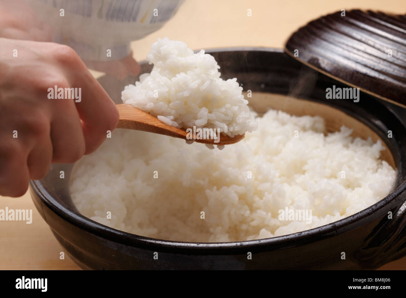 Steamed rice in a pot Stock Photo - Alamy