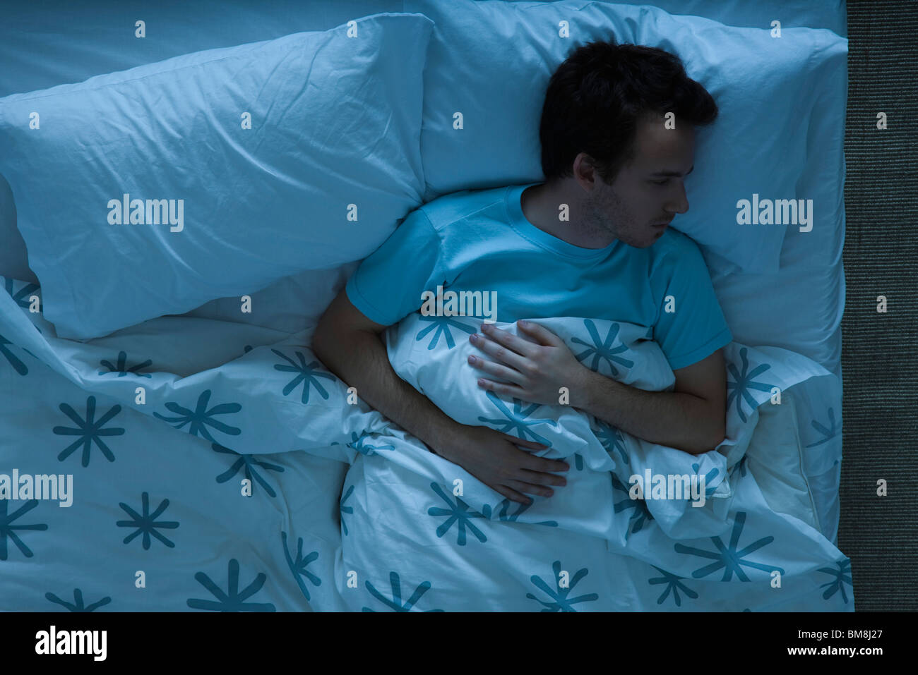 Man sleeping in bed overhead hi-res stock photography and images - Alamy