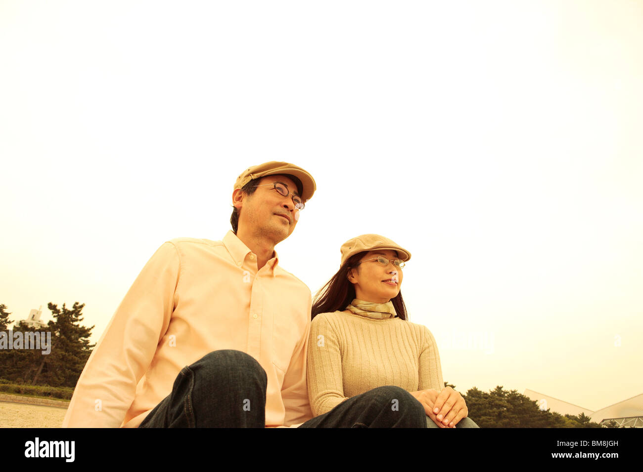 Mature couple sitting side by side Stock Photo - Alamy Mature couple sitting side by side Stock Photo - Alamy