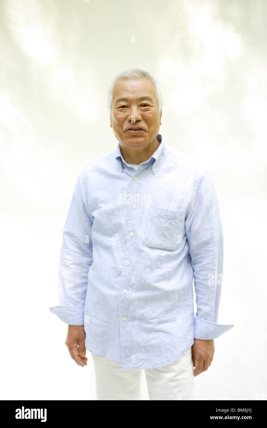 Portrait of senior man smiling, white background Stock Photo - Alamy