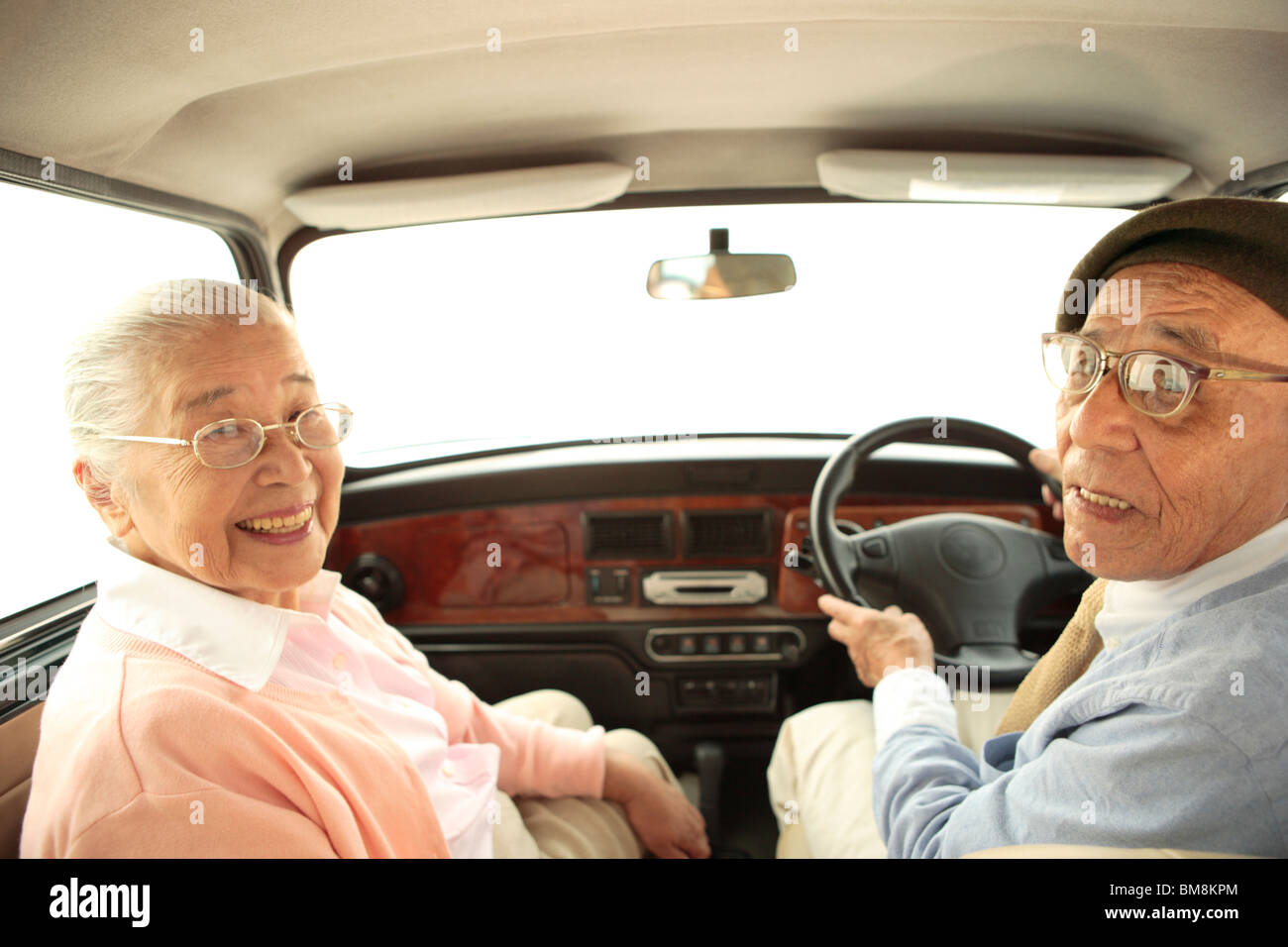 Senior couple driving a car Stock Photo - Alamy