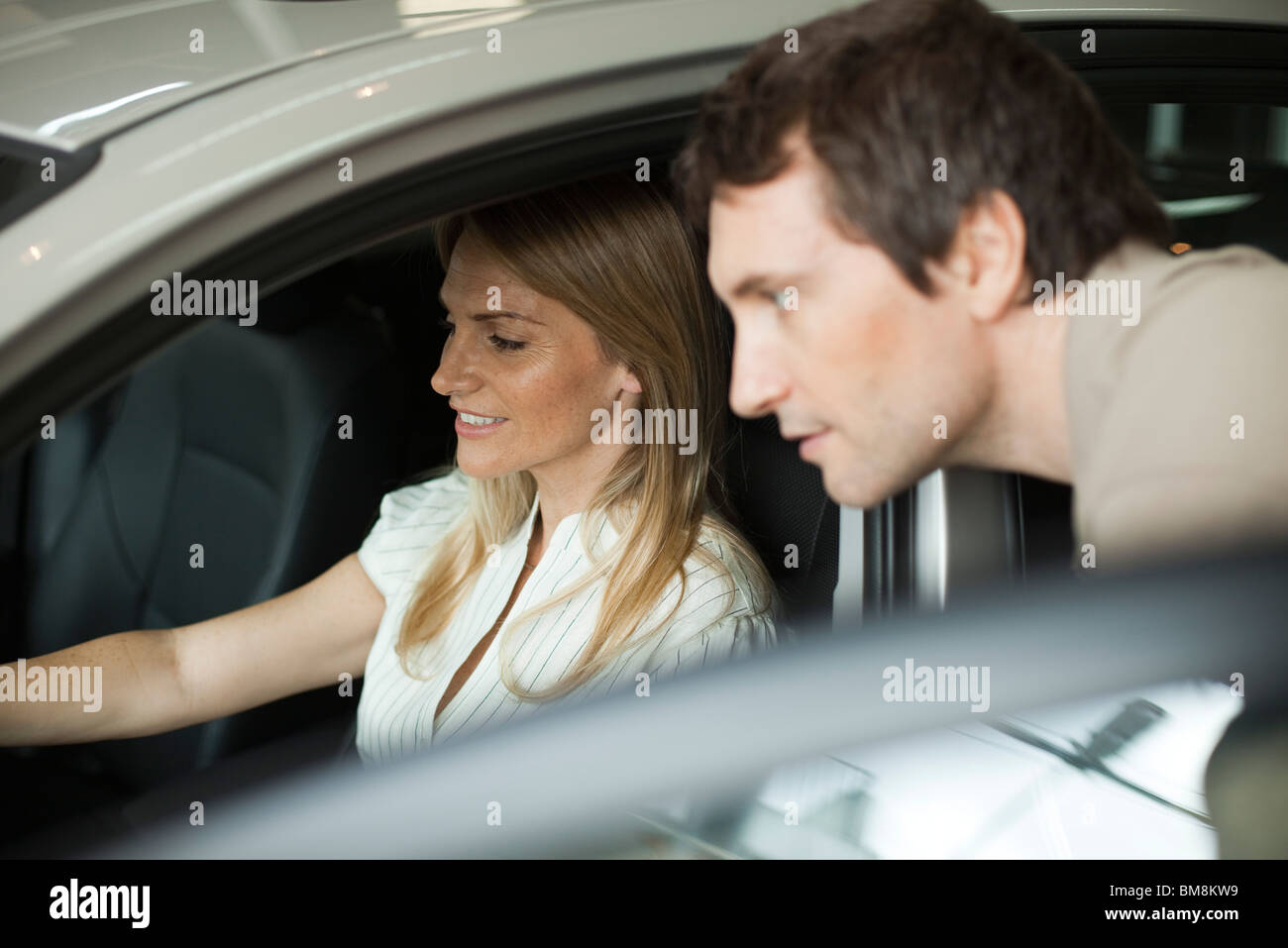 Couple checking out new car hi-res stock photography and images - Alamy