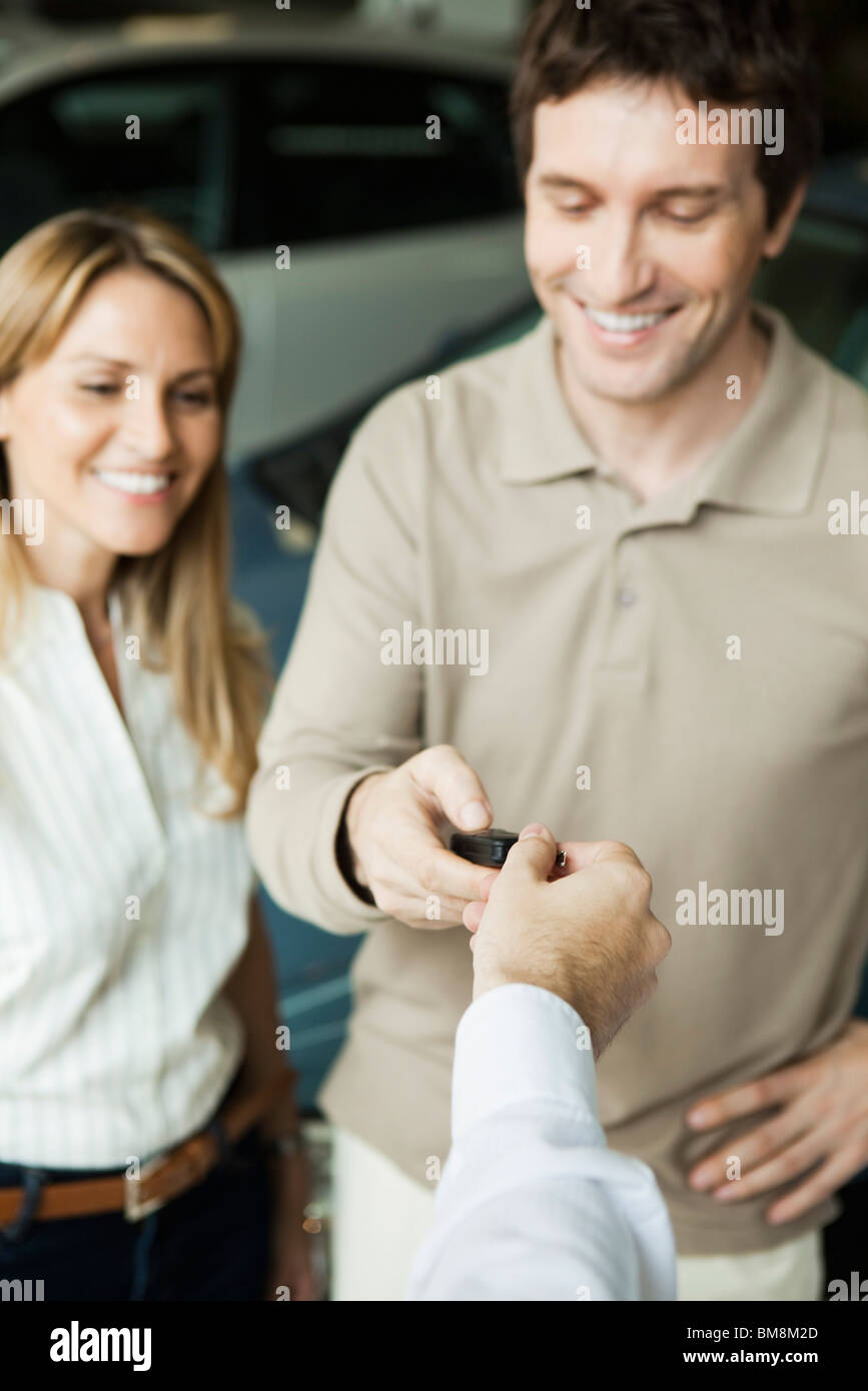 Handing car key to customer Stock Photo - Alamy