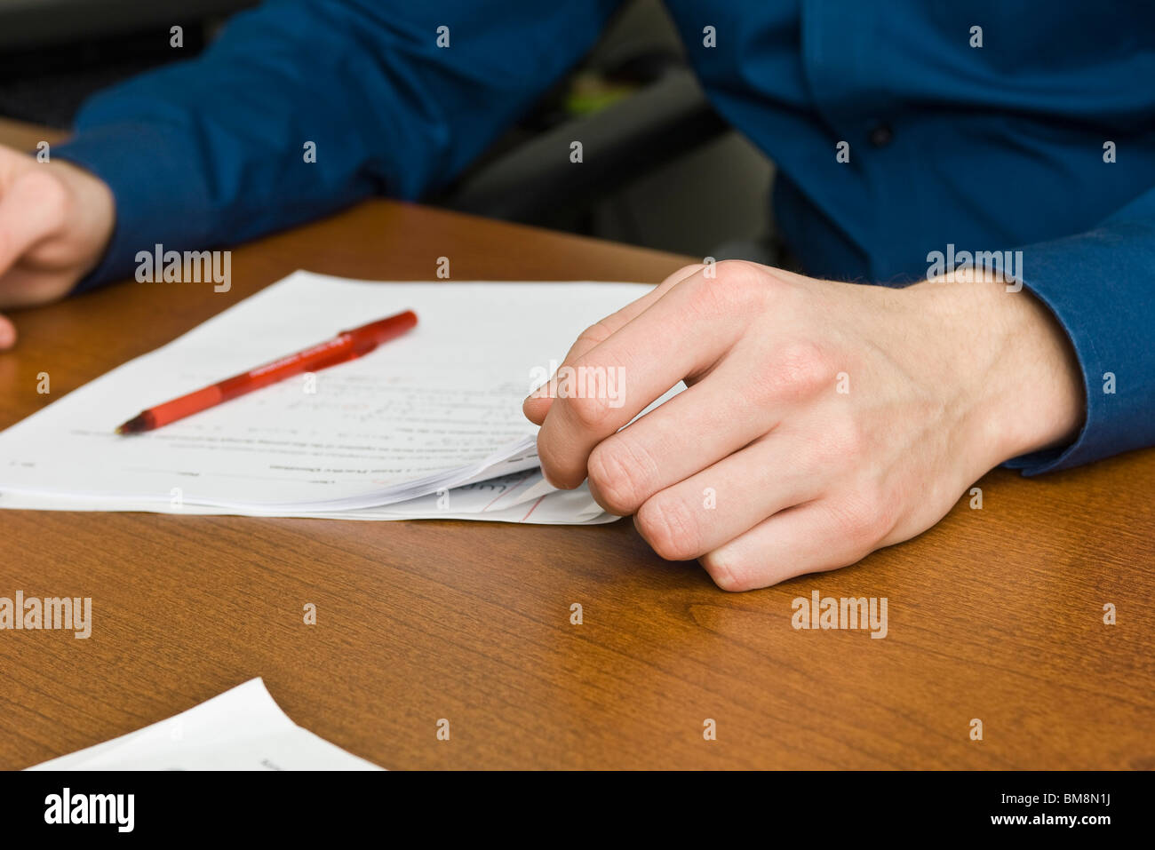 Person reading document Stock Photo - Alamy
