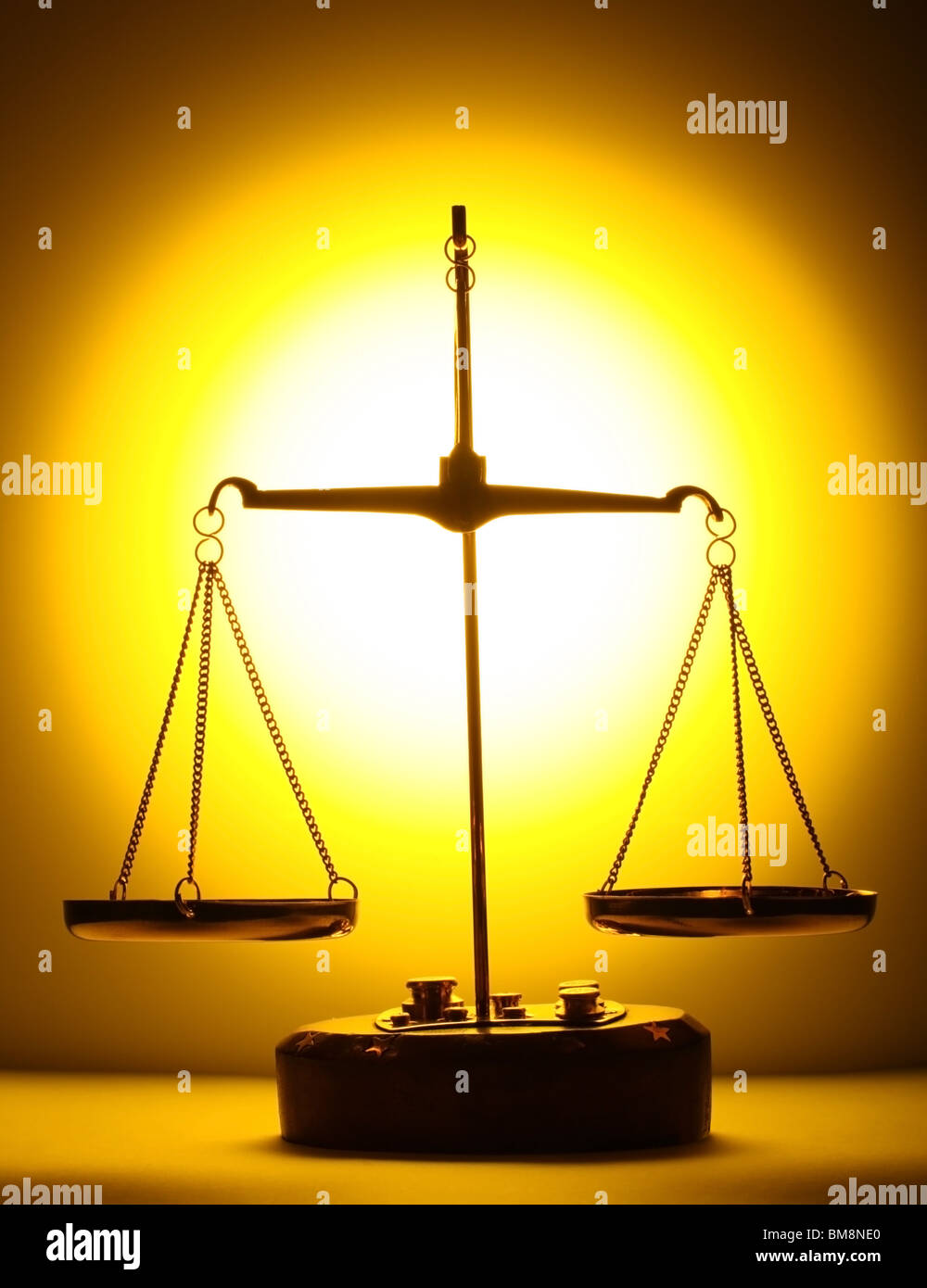 Scales on yellow light background Stock Photo - Alamy
