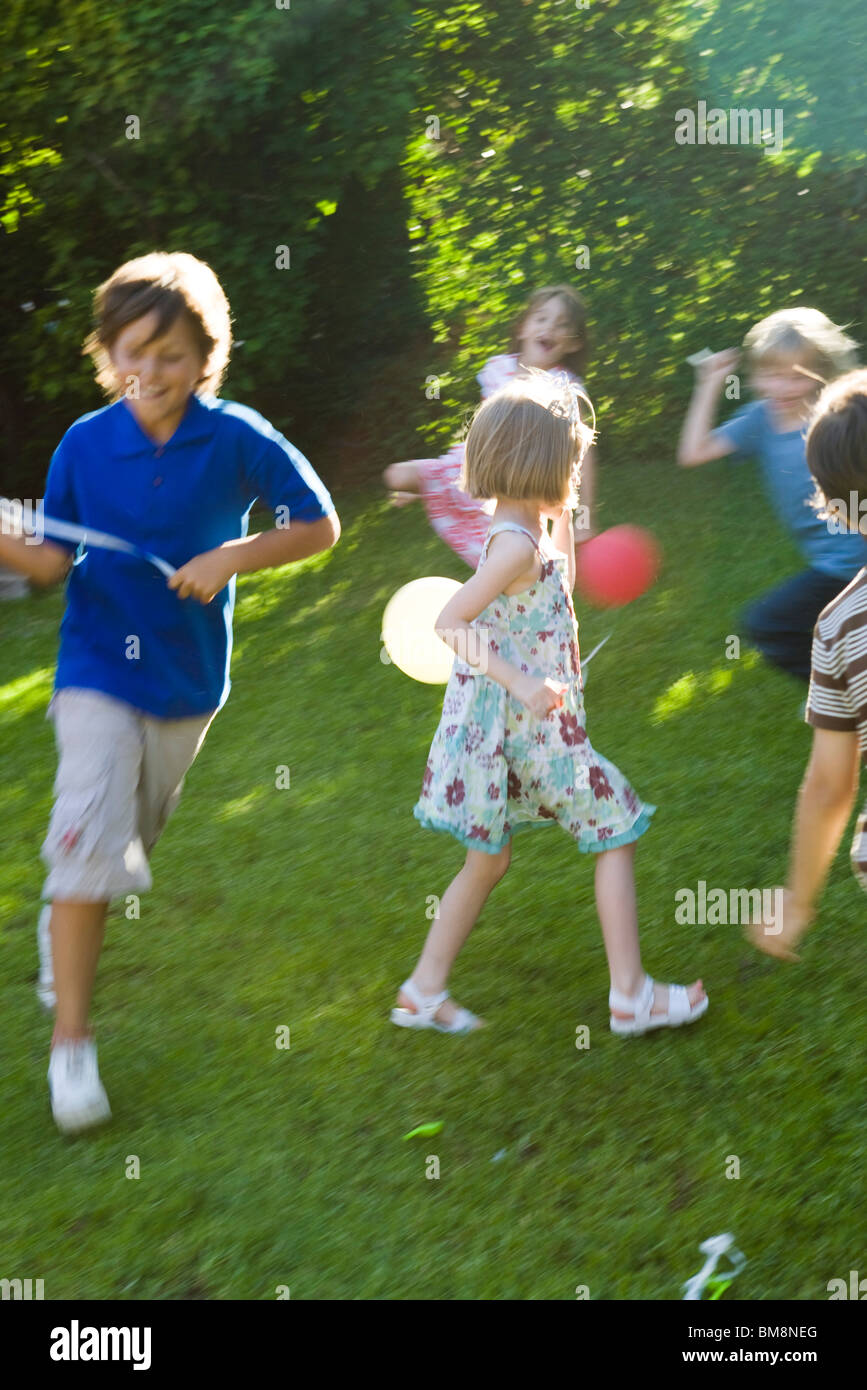 Children playing outdoors with balloons Stock Photo - Alamy