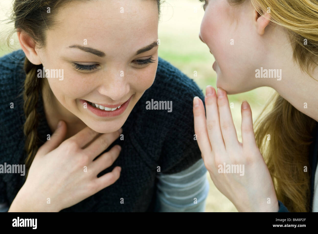 Two women gossiping telling secrets hi-res stock photography and images ...
