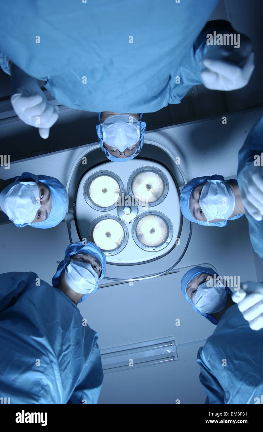 Operating room nurse looking down hi-res stock photography and images ...