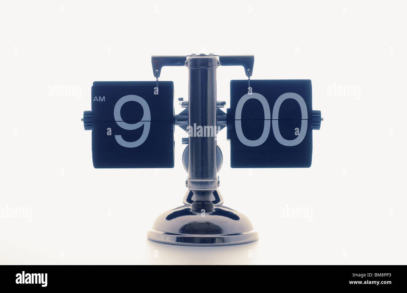 Clock showing 9 o'clock, white background Stock Photo - Alamy