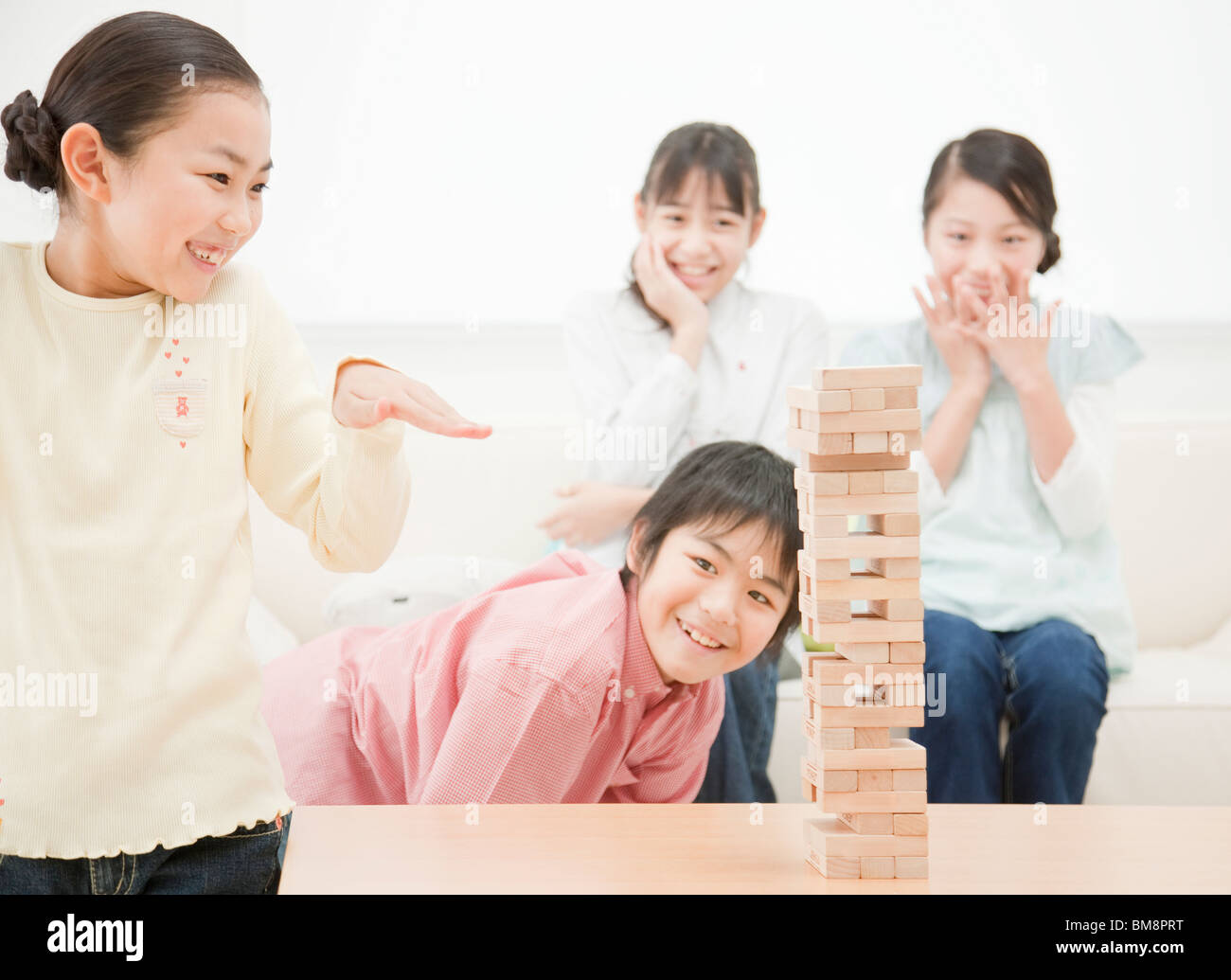 Friends playing Jenga Stock Photo - Alamy