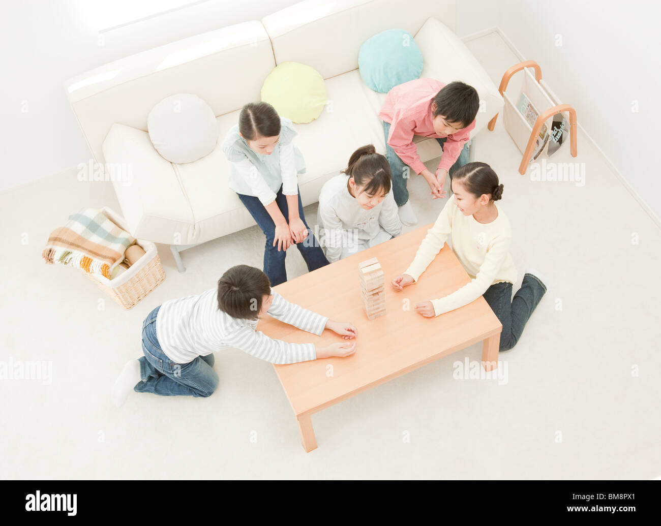 Friends playing Jenga, high angle view Stock Photo - Alamy