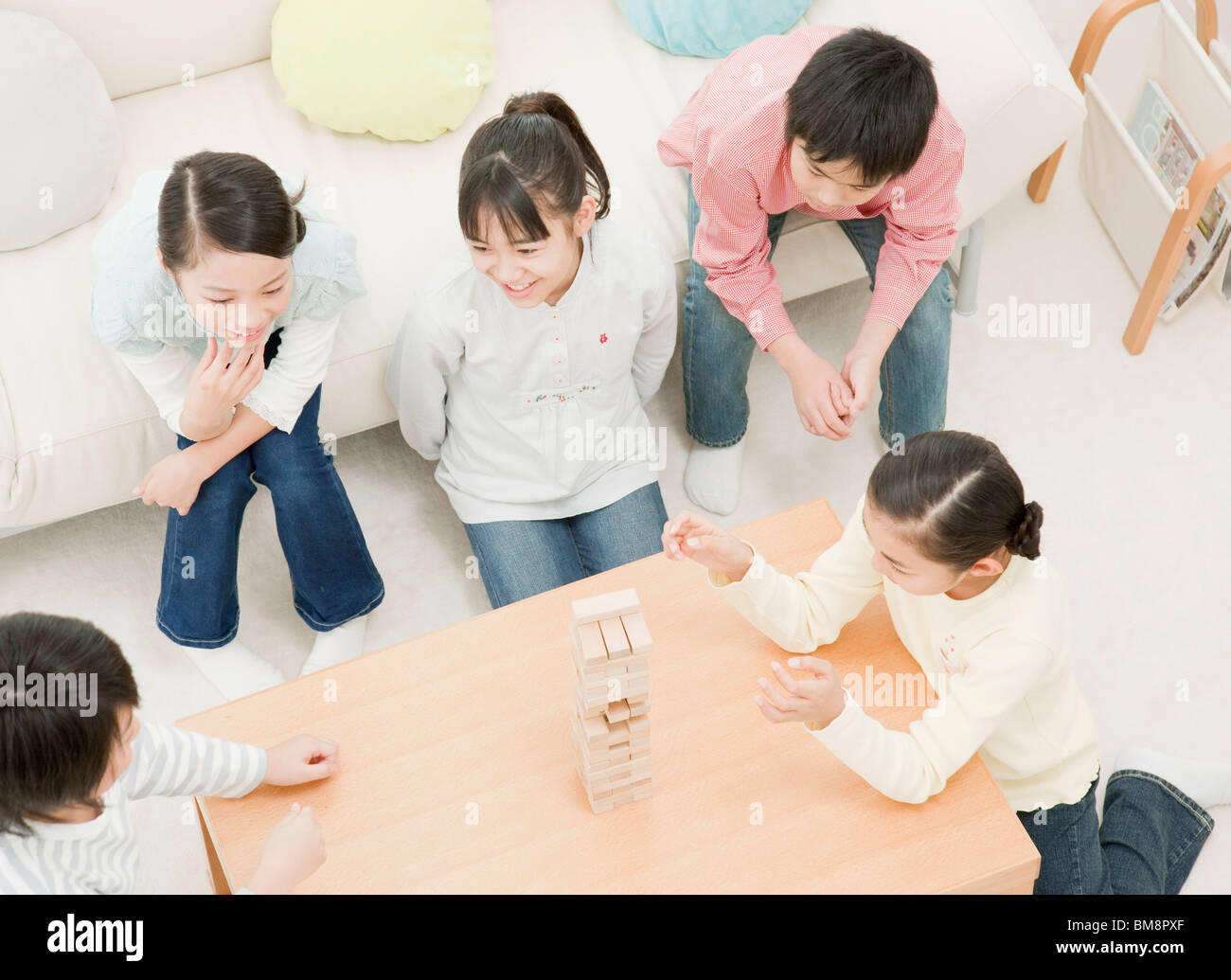 Friends playing Jenga, high angle view Stock Photo - Alamy