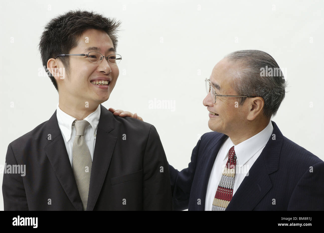 Patting shoulder hi-res stock photography and images - Alamy