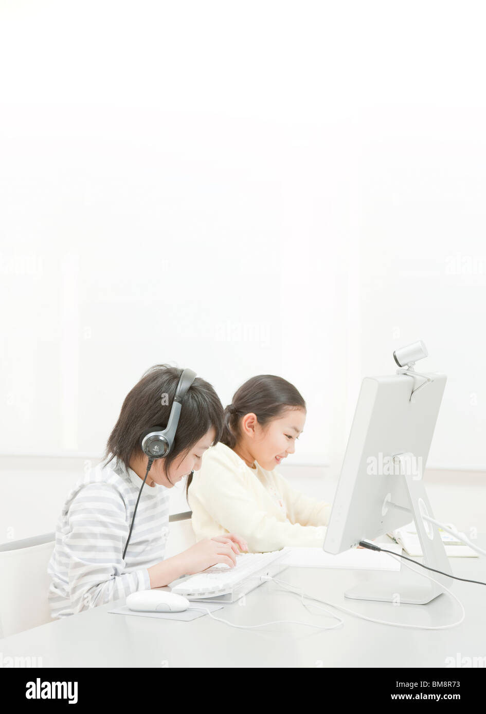 Children Studying at Desk, Desktop Computer on the Desk Stock Photo - Alamy