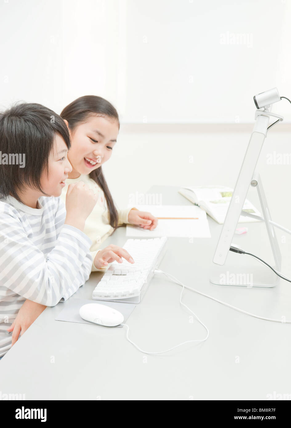 Children Studying at Desk, Desktop Computer on the Desk Stock Photo - Alamy