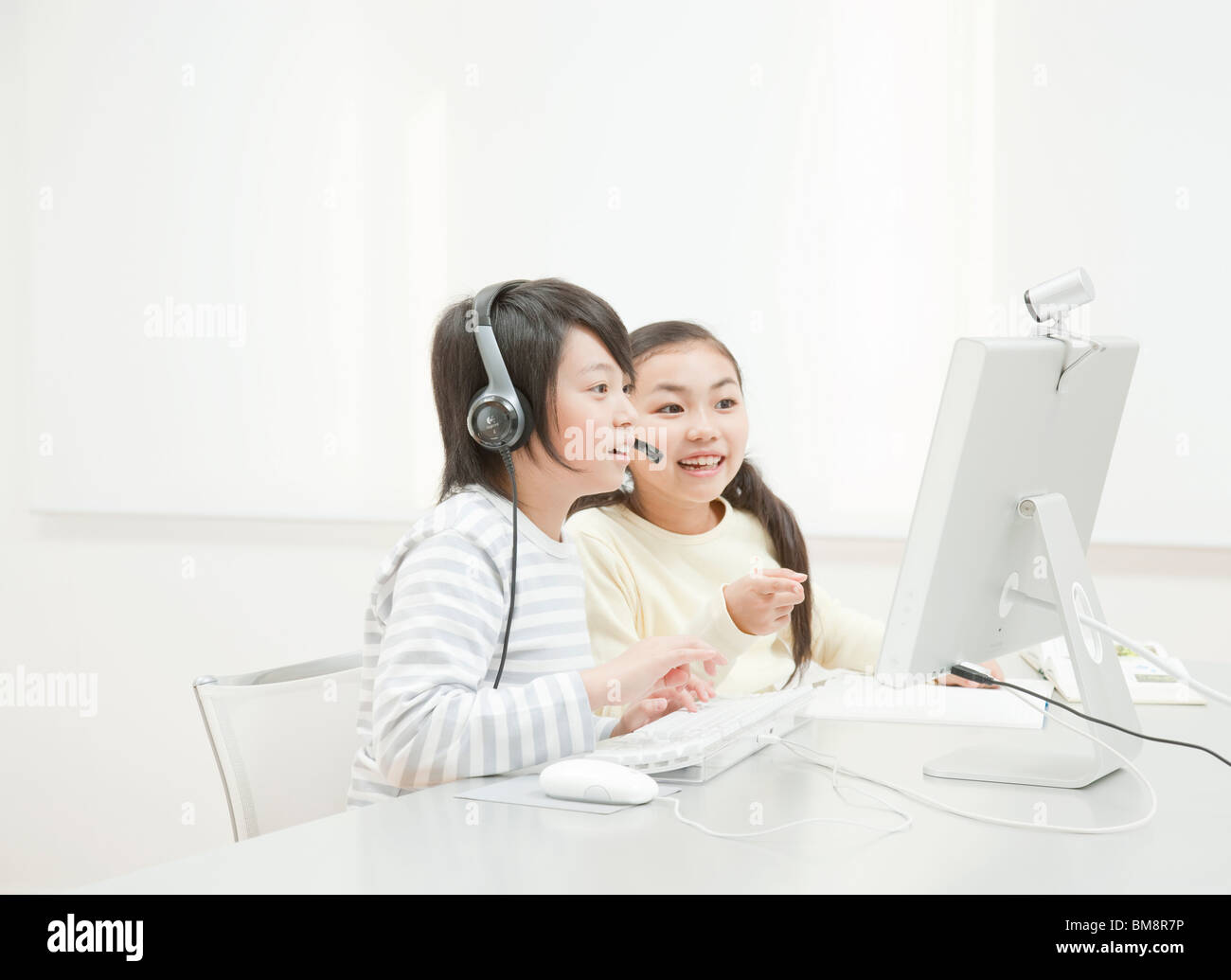 Children Studying at Desk, Desktop Computer on the Desk Stock Photo - Alamy