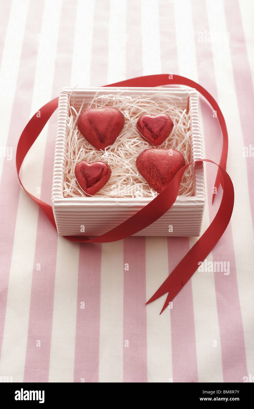 Four Red Heart Chocolates in Box Stock Photo - Alamy