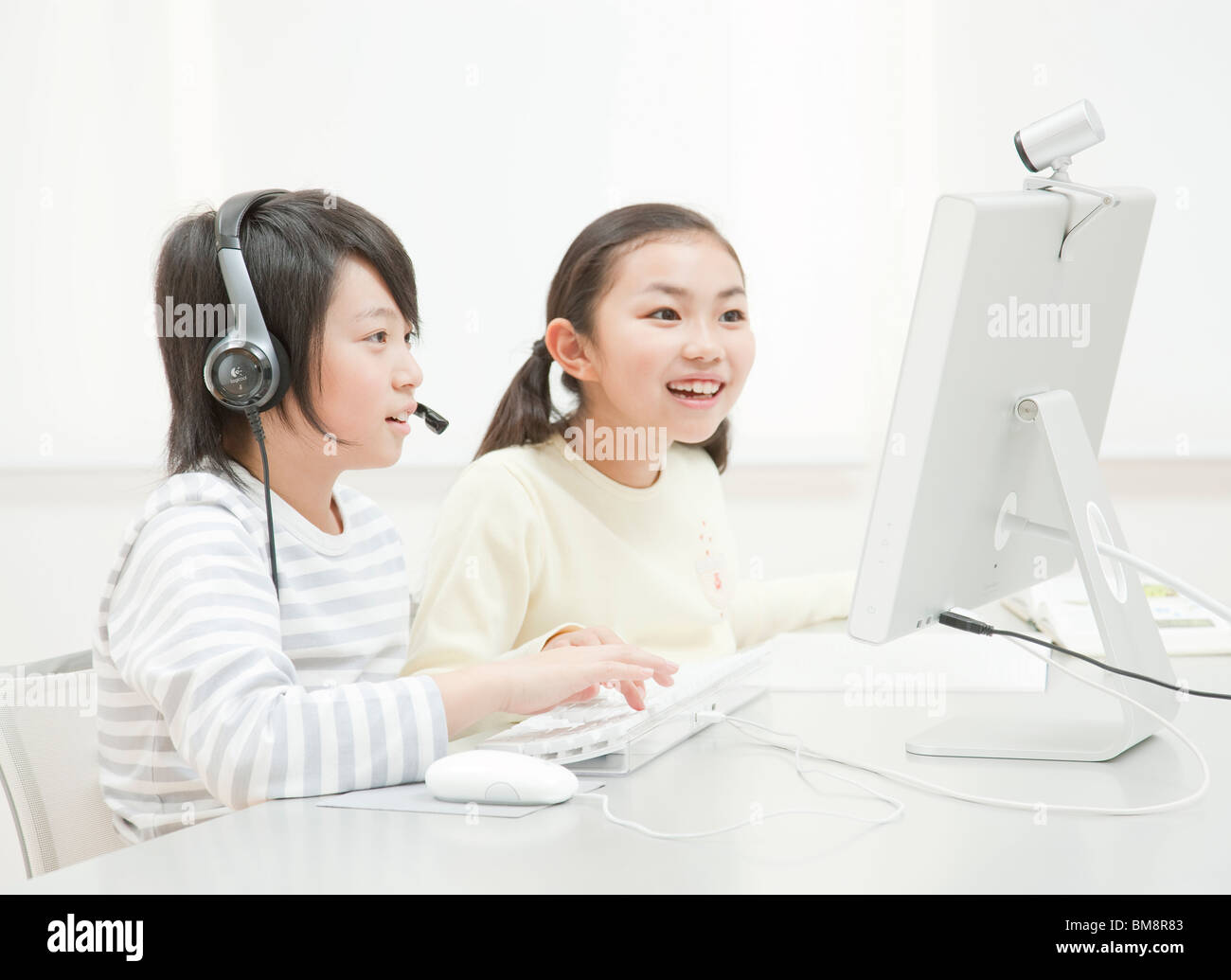 Children Studying at Desk, Desktop Computer on the Desk Stock Photo - Alamy