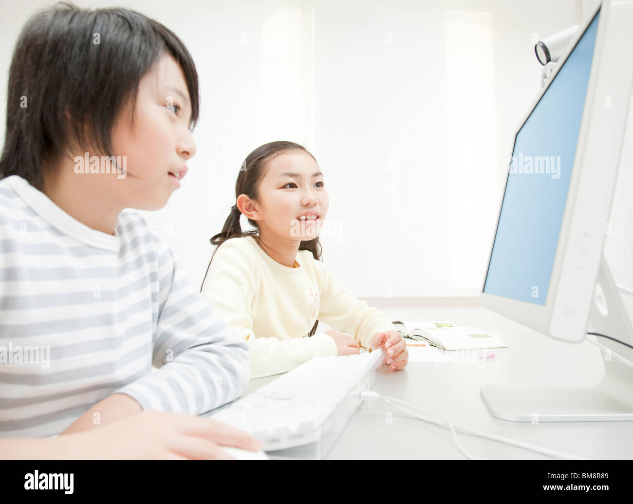 Children Studying at Desk, Desktop Computer on the Desk Stock Photo - Alamy